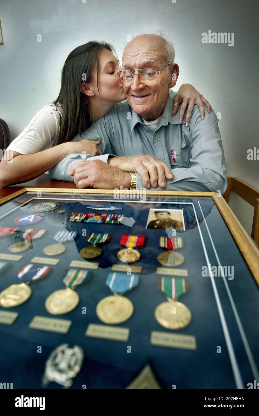 In this March 31, 2010 photo, 90 year-old Albin Pribyl gets a kiss from ...