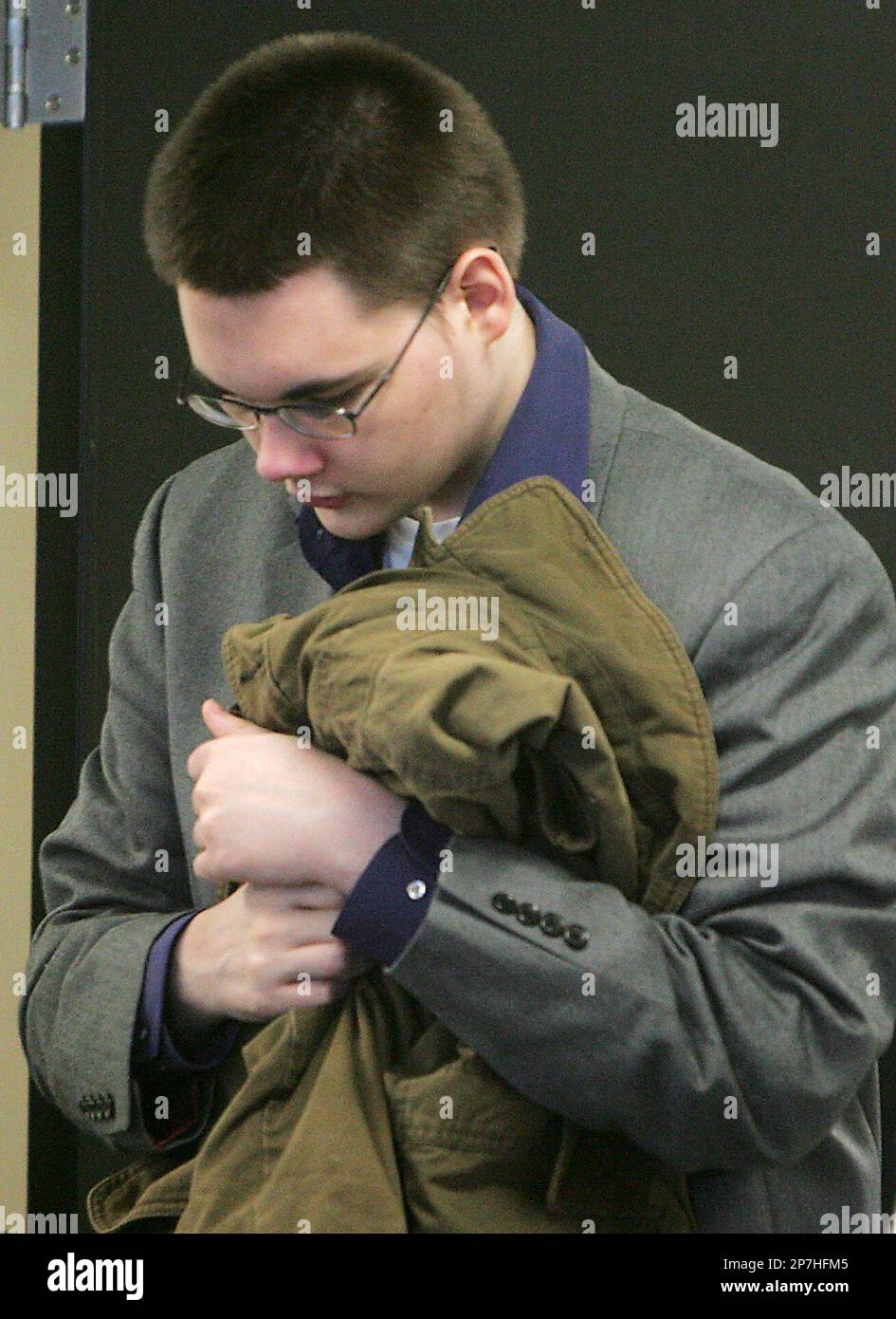 John Odgren enters the courtroom on the first day of his trial for the ...