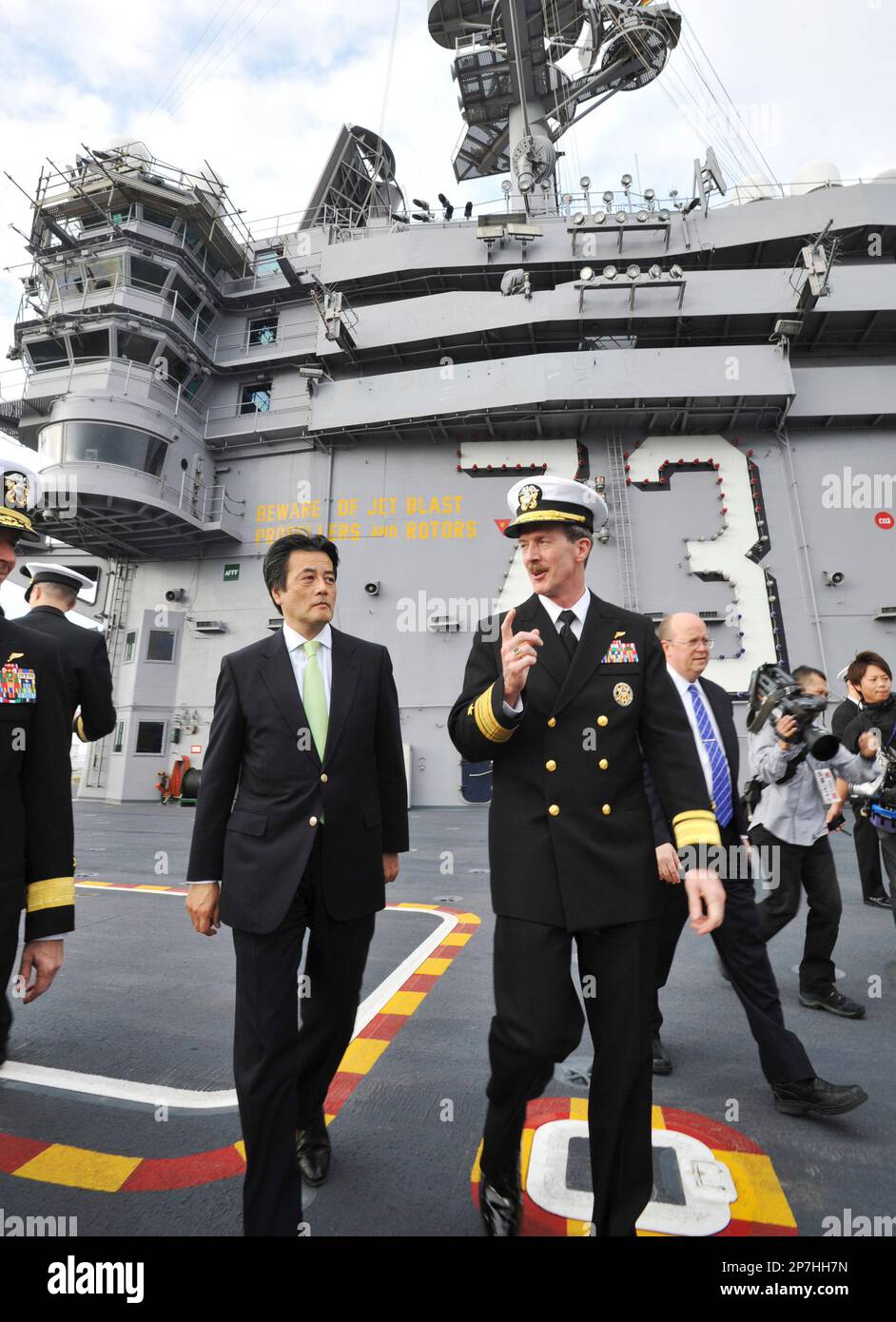 Japan's Foreign Minister Katsuya Okada, left, listens to Rear Adm ...