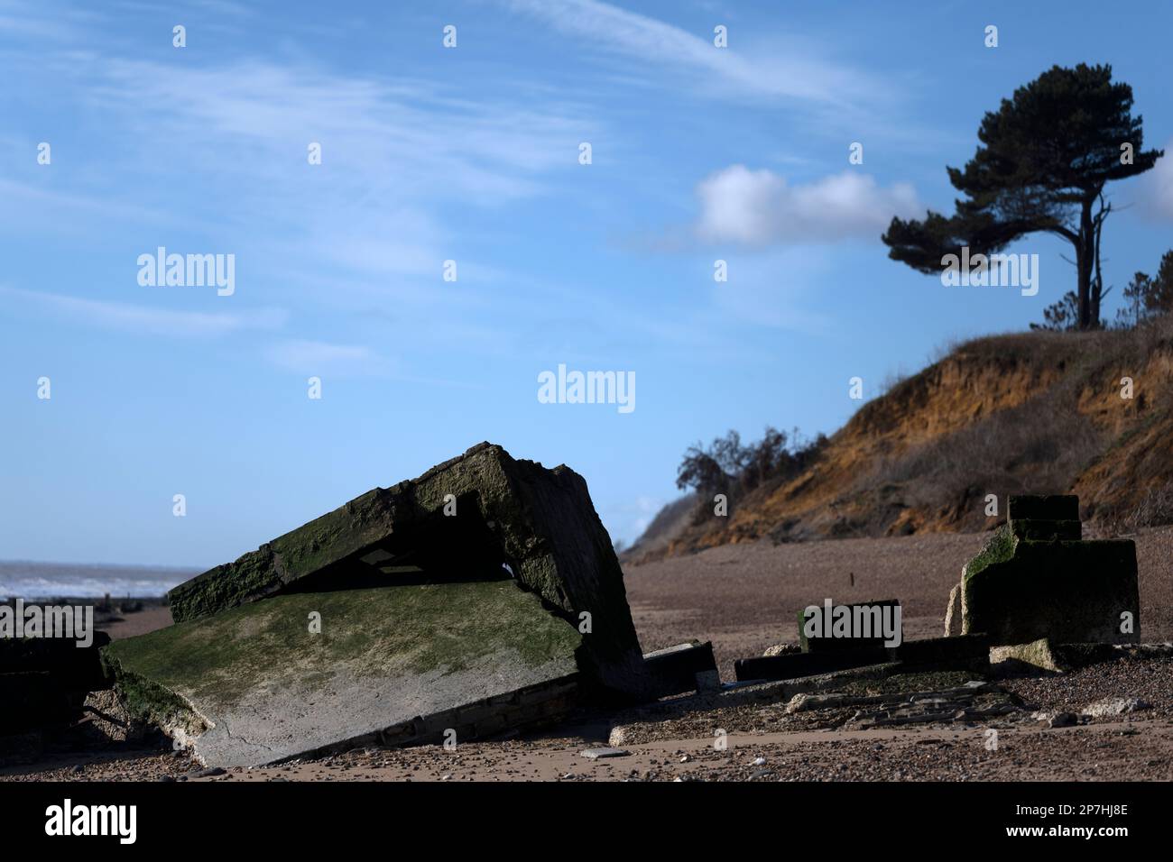 Wartime pillbox on the beach due to costal erosion Bawdsey Suffolk UK ...