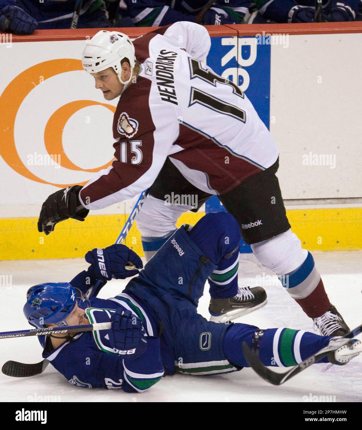 Vancouver Canucks Daniel Sedin, left, fights for control of the puck ...