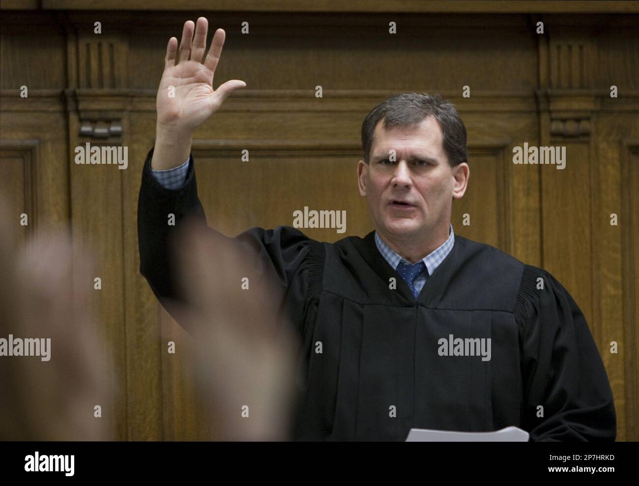 District Court Judge Arthur Chapman swears in potential jurors during ...
