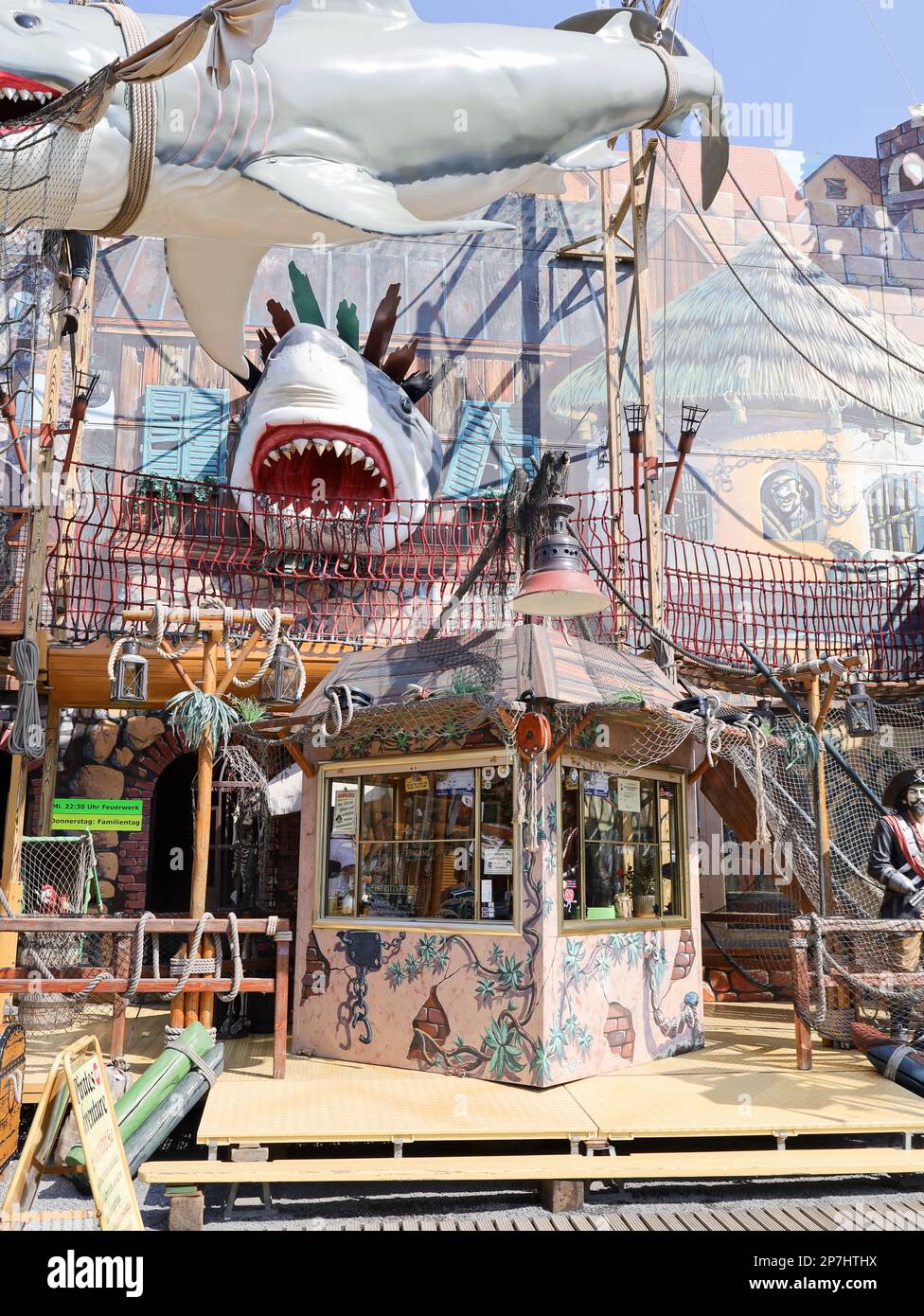 colorful booths and fun rides at a fairground Stock Photo - Alamy