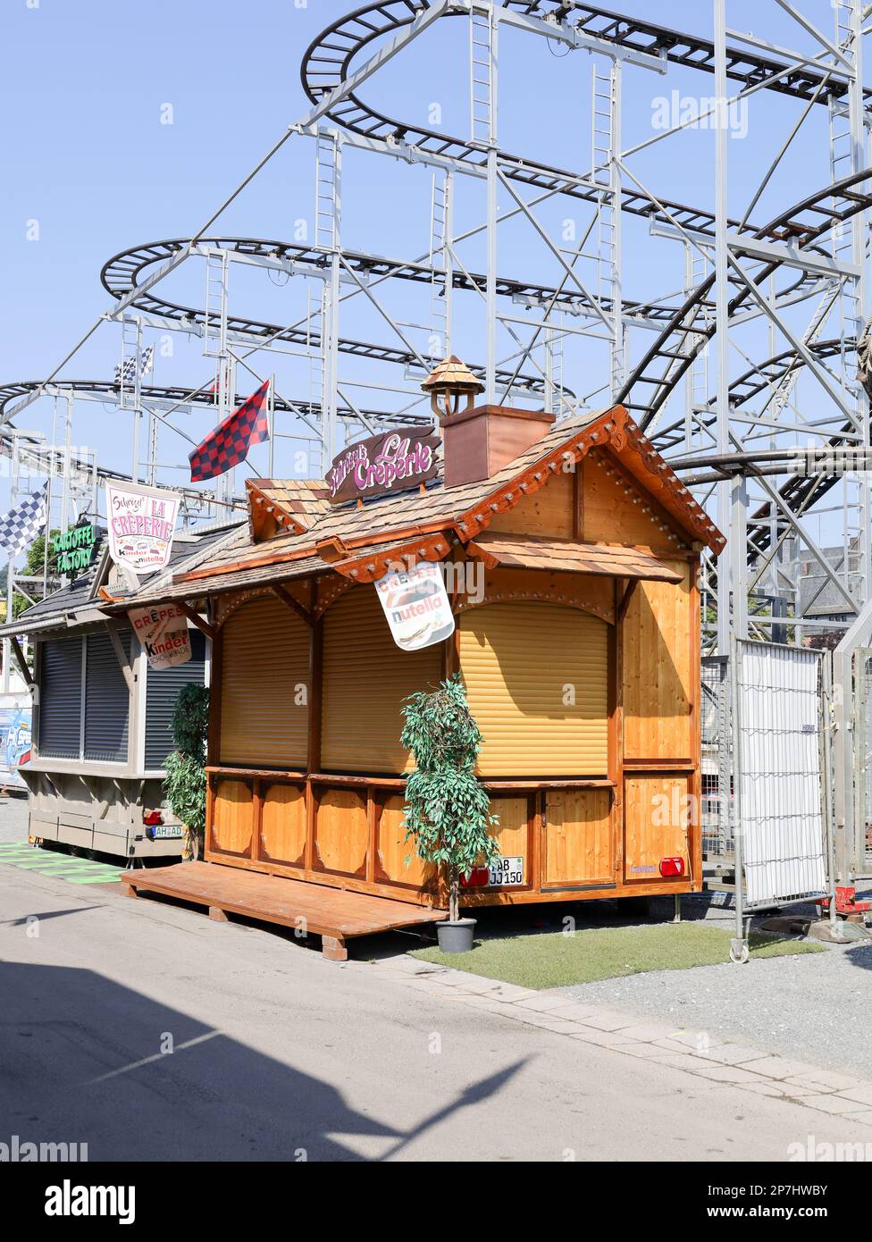 colorful booths and fun rides at a fairground Stock Photo - Alamy