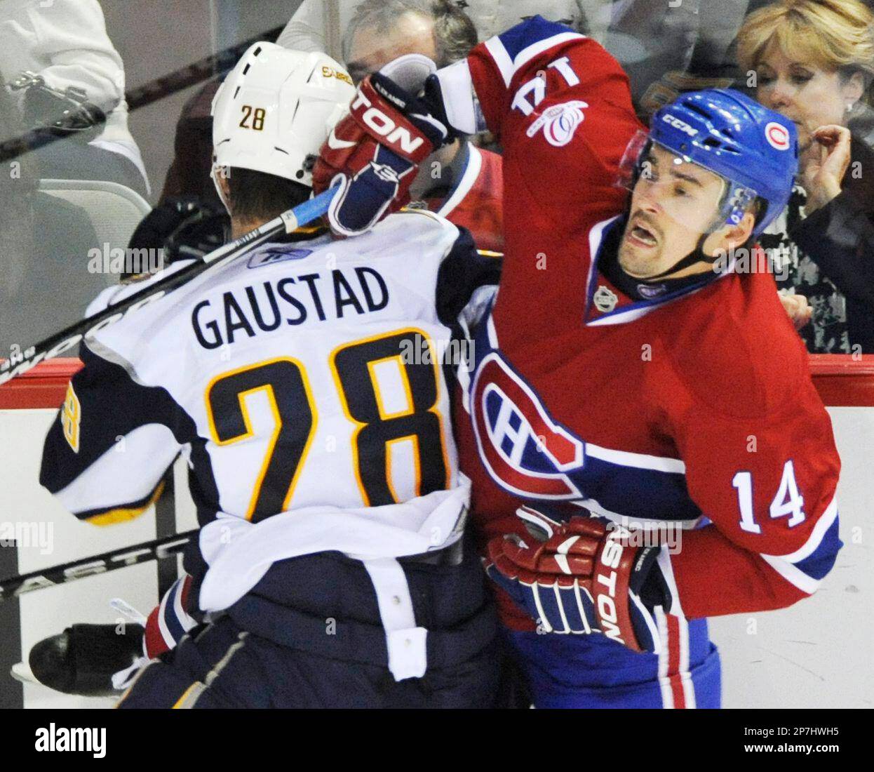 Buffalo Sabres' Paul Gaustad checks Montreal Canadiens' Tomas Plekanec ...