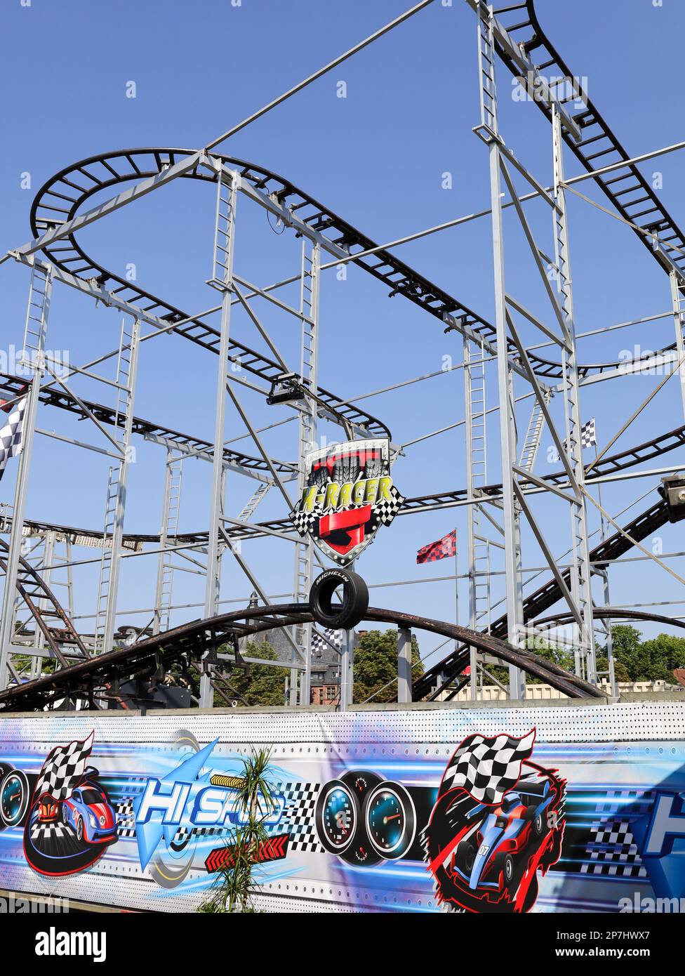 colorful booths and fun rides at a fairground Stock Photo - Alamy