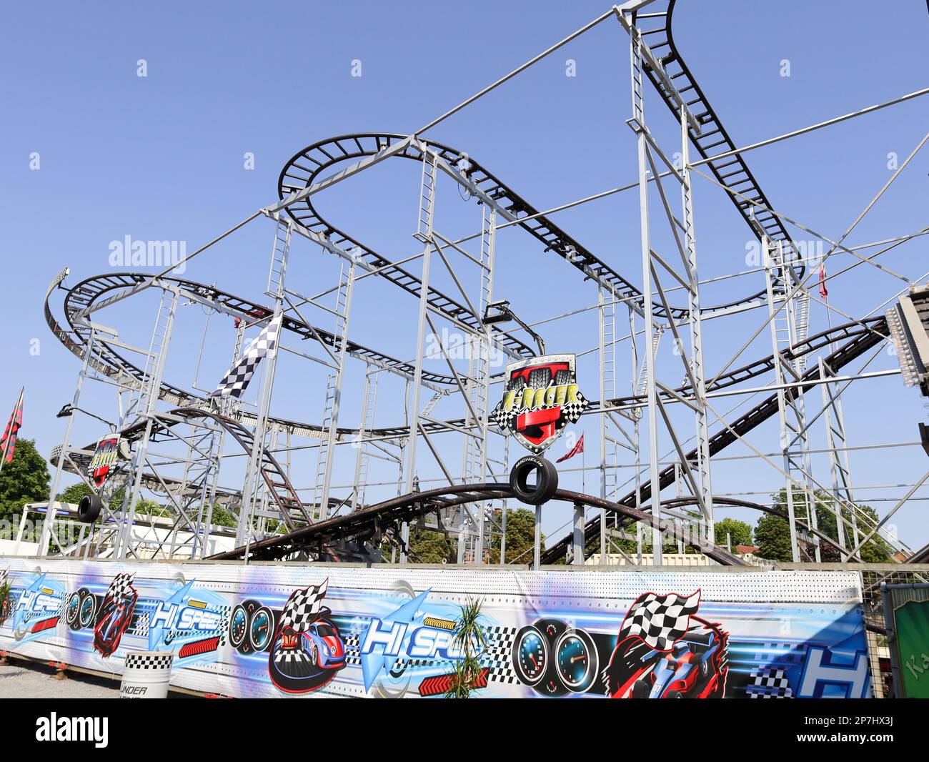 colorful booths and fun rides at a fairground Stock Photo - Alamy