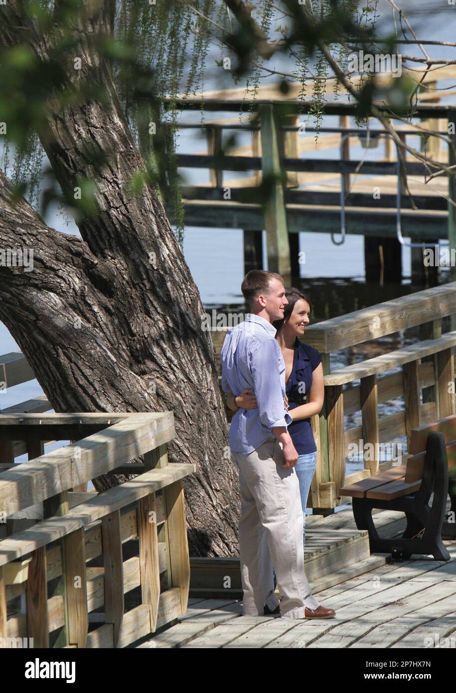 Dustin Moon and wife Victoria Moon pose for a picture along the ...