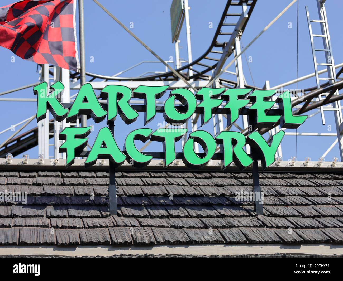 colorful booths and fun rides at a fairground Stock Photo - Alamy