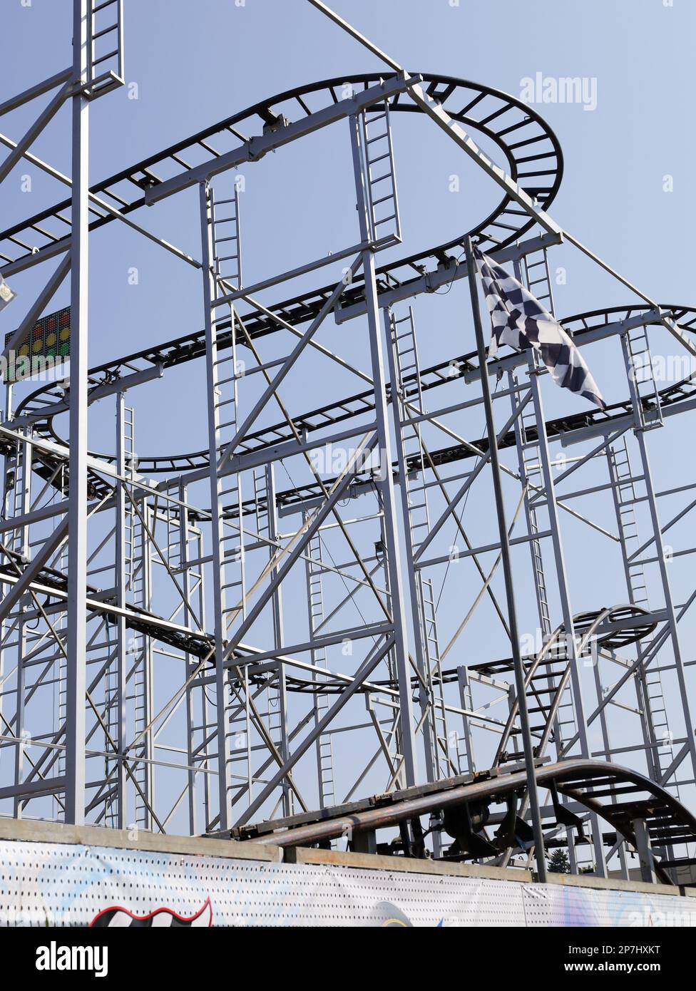 colorful booths and fun rides at a fairground Stock Photo - Alamy