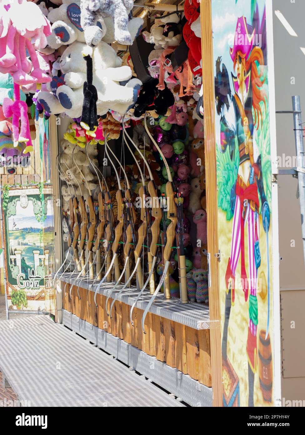 colorful booths and fun rides at a fairground Stock Photo - Alamy