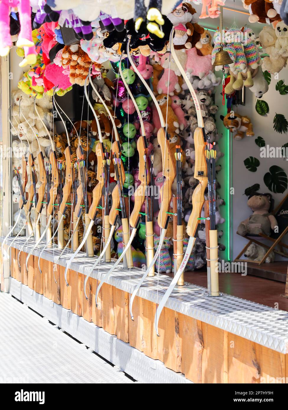 colorful booths and fun rides at a fairground Stock Photo - Alamy