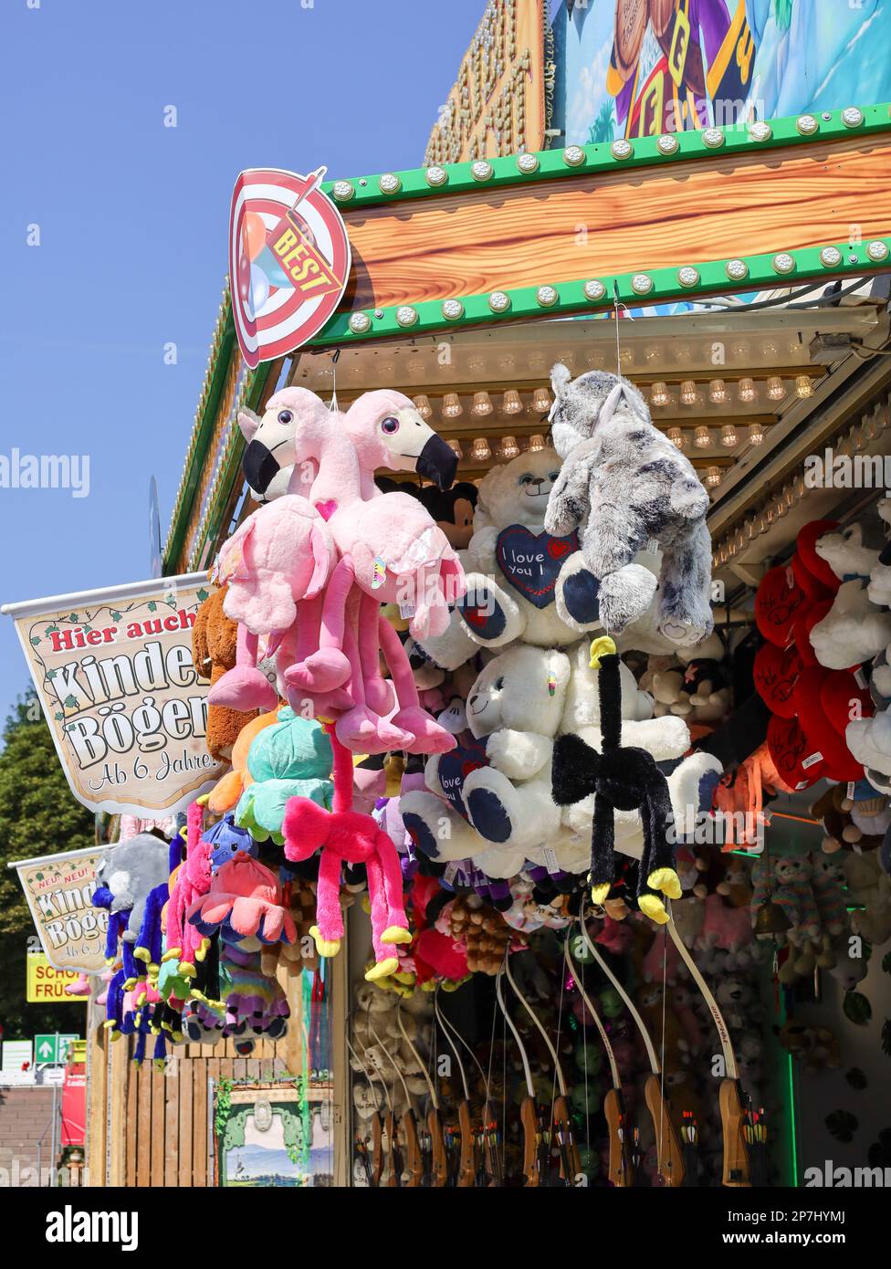 colorful booths and fun rides at a fairground Stock Photo - Alamy