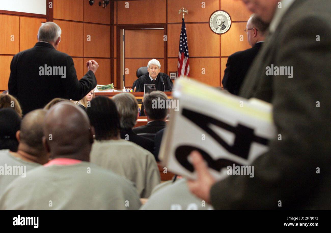 Pierce County Superior Court Judge Thomas Felnagle, right, listens to ...