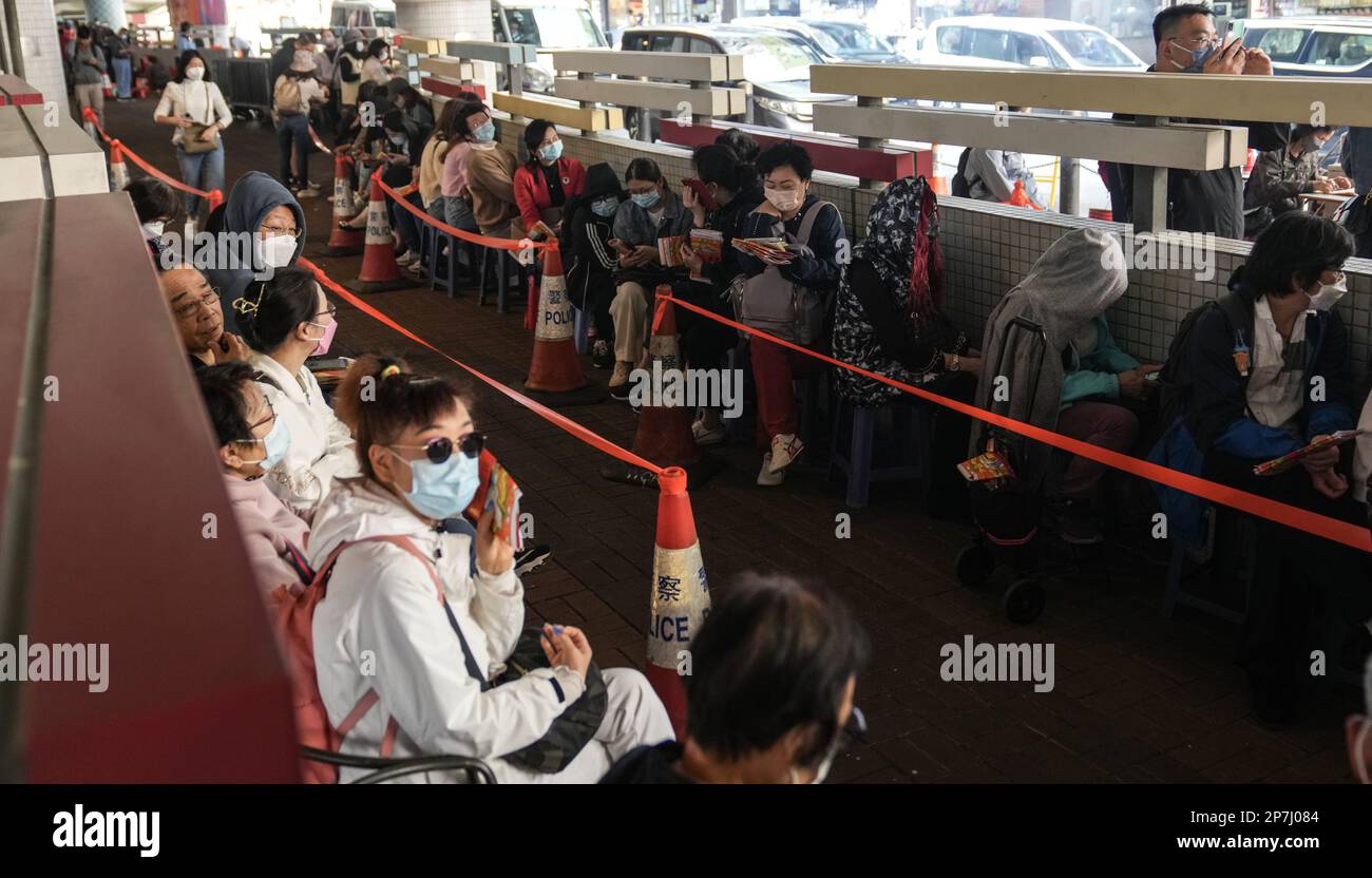 People perform a 'villain hitting' ceremony under the Canal Road ...