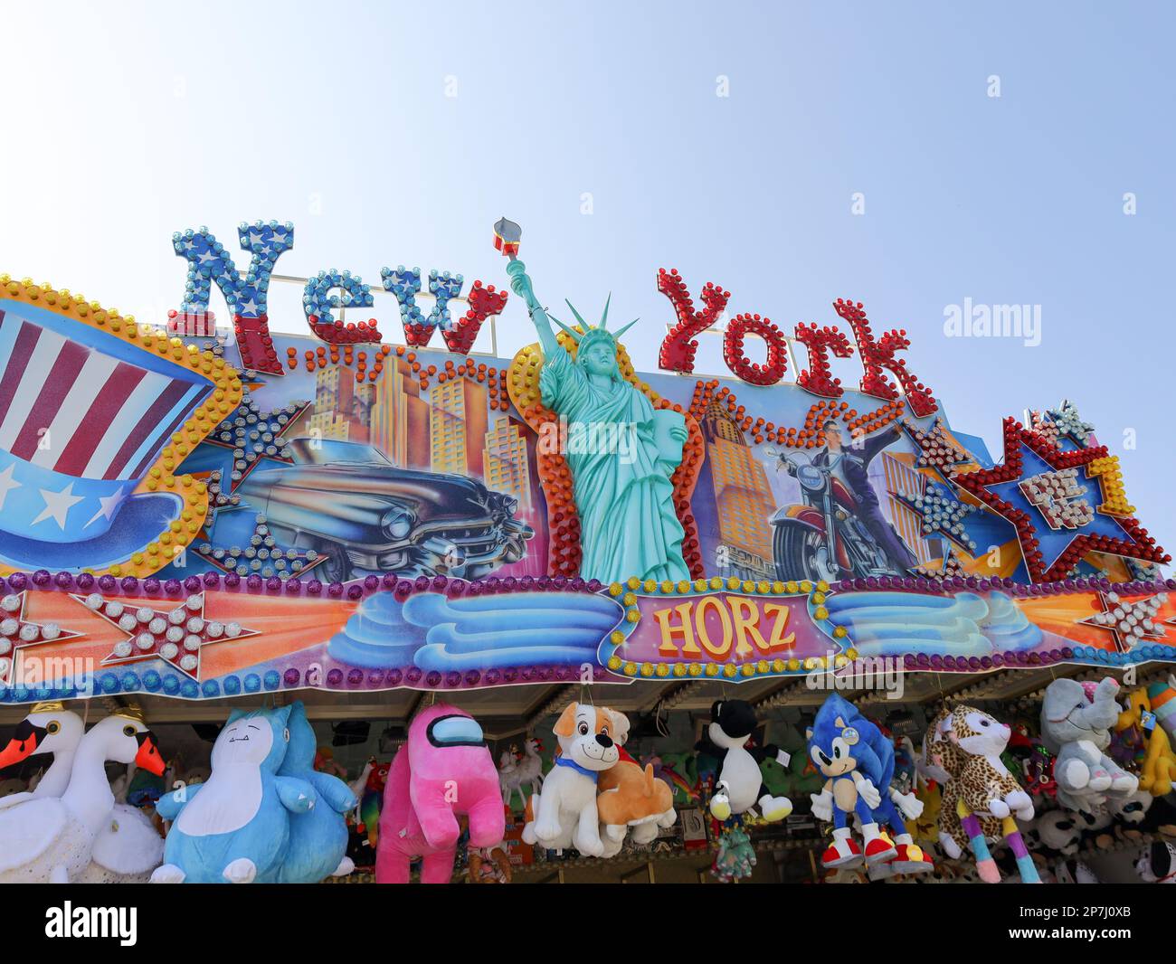 colorful booths and fun rides at a fairground Stock Photo - Alamy