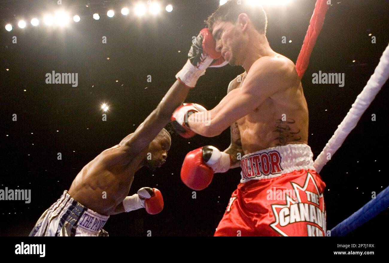Canada's Steve Molitor, right, is caught by a punch from South Africa's ...