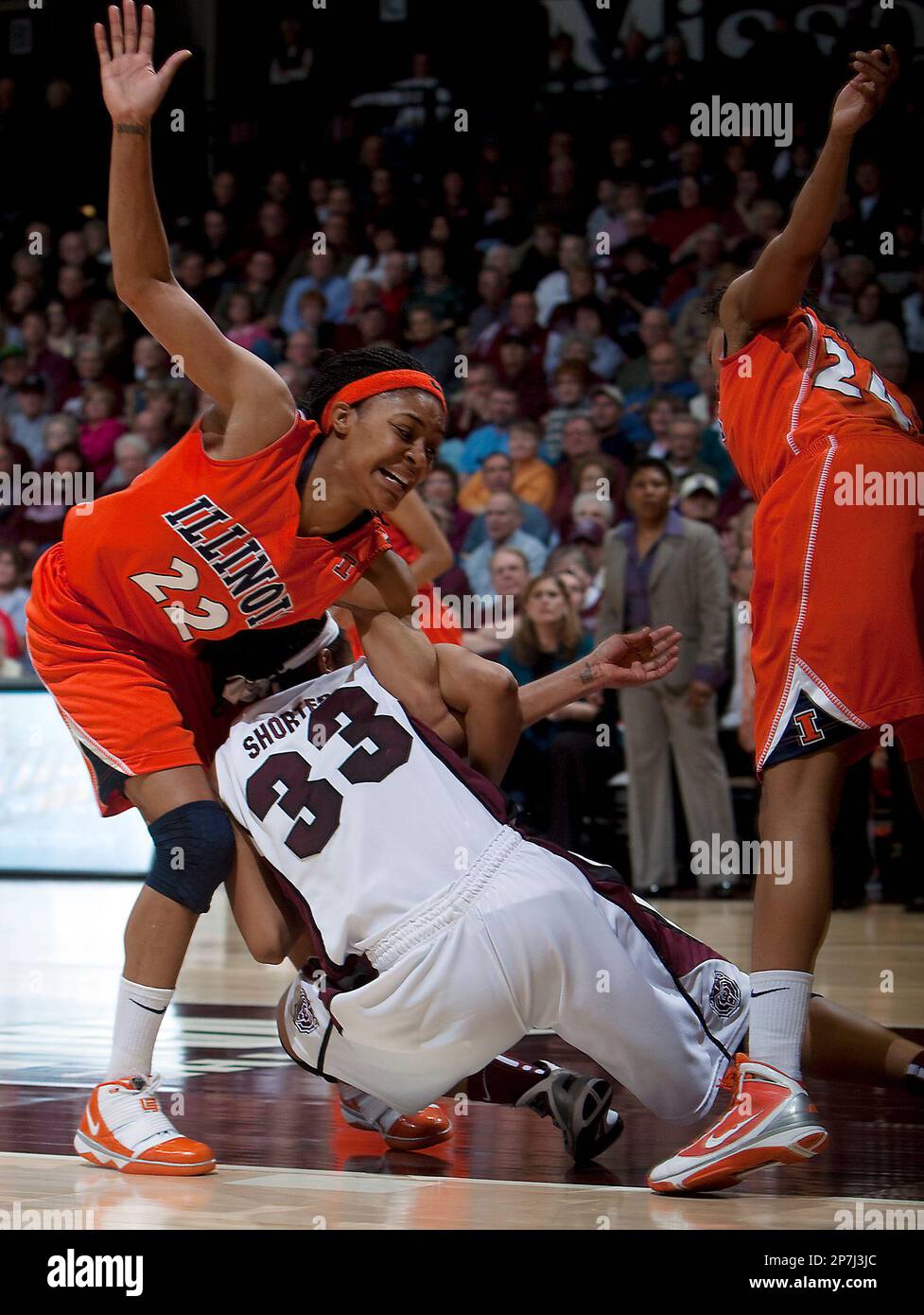 Illinois forward Lacey Simpson, left, battles for a loose basketball ...