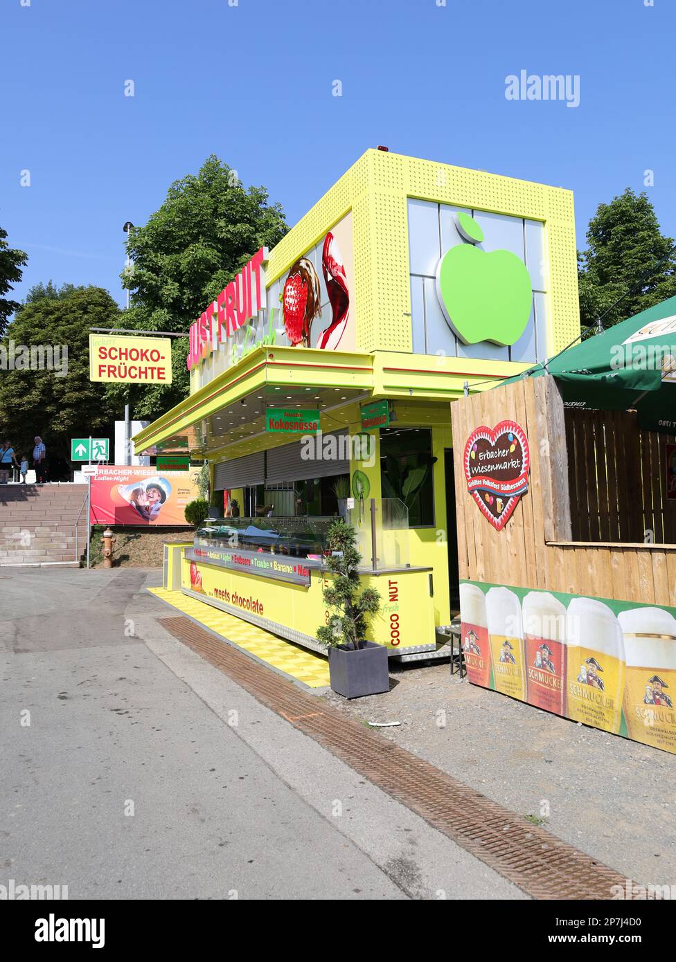 colorful booths and fun rides at a fairground Stock Photo - Alamy