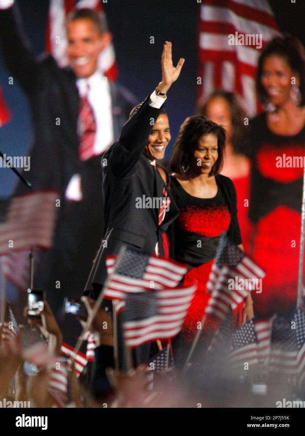 President elect, Barack Obama and his wife Michelle wave to supporters ...
