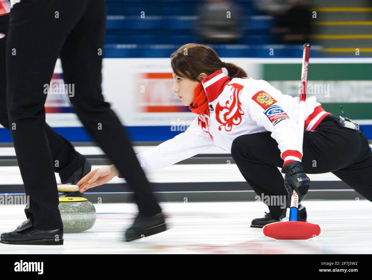 Russia skip Anna Sidorova throws her rock while playing against Denmark ...