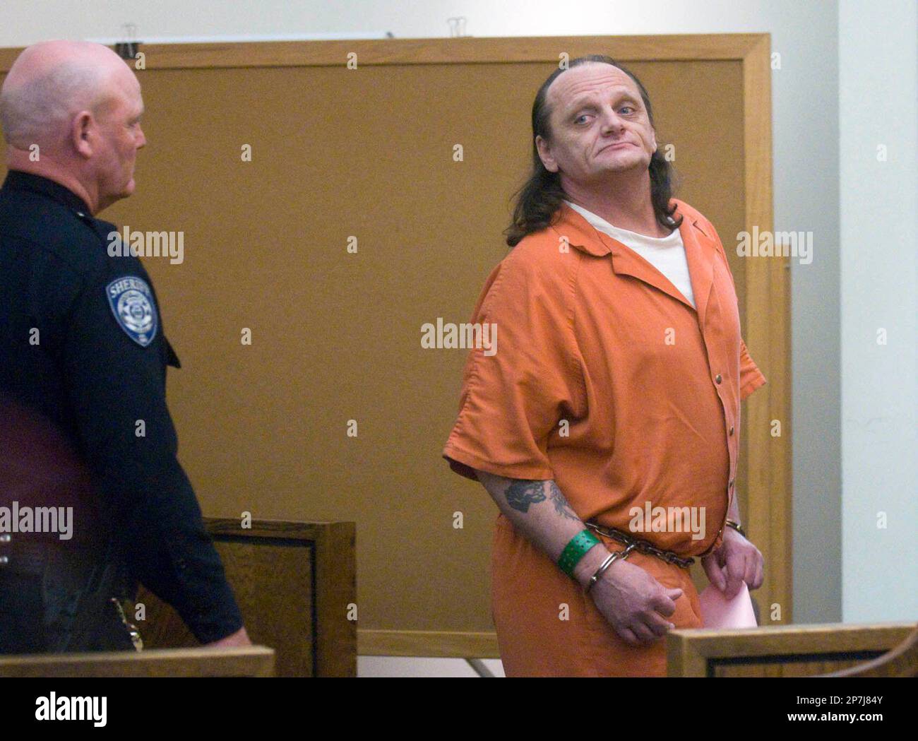 Pete Kimball Roberts, right, looks back to family members as he exits ...