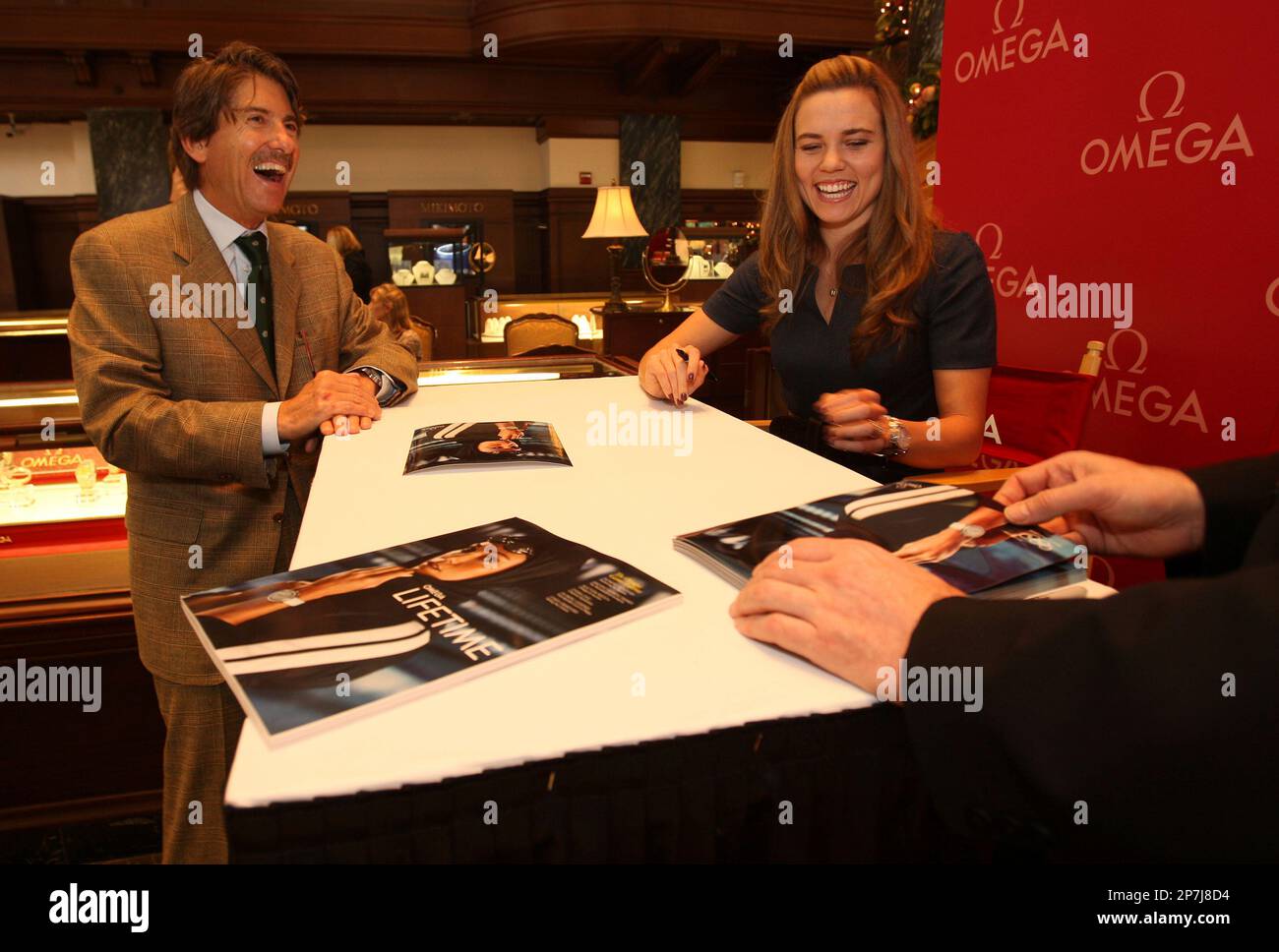 Olympic champion swimmer, Natalie Coughlin, signs a pictures for Russ ...
