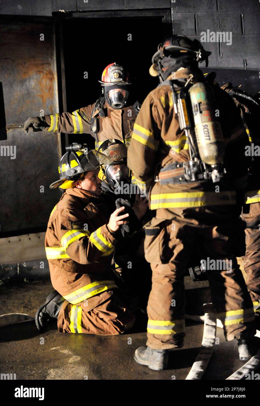 In a March 8, 2010 photo, Macon-Bibb firefighter David McCullough, left ...