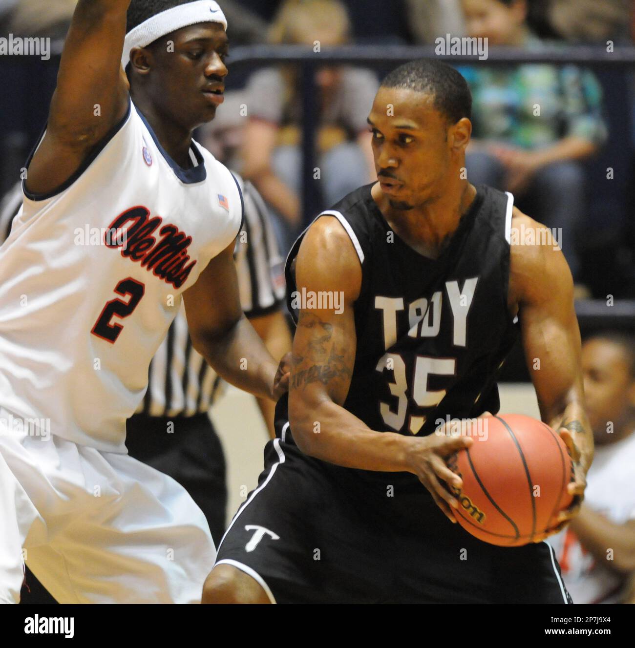 Troy's Yamene Coleman (35) is defended by Mississippi's Reginald ...