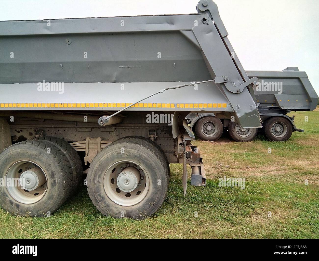 two dump trucks - big machines Stock Photo - Alamy