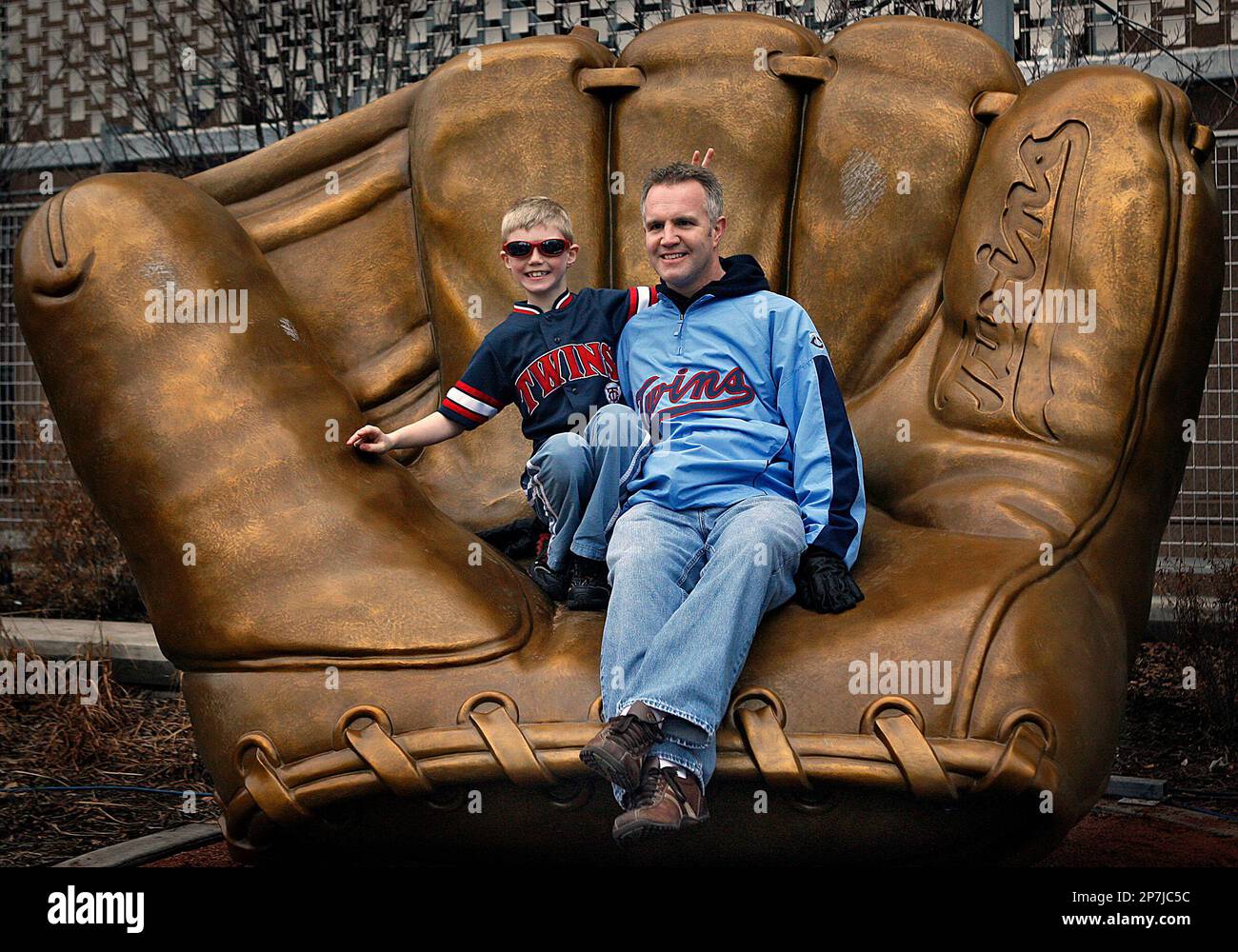 Mark Robinson, of Maple Grove, Minn., and his son, Caleb, 8, are ...