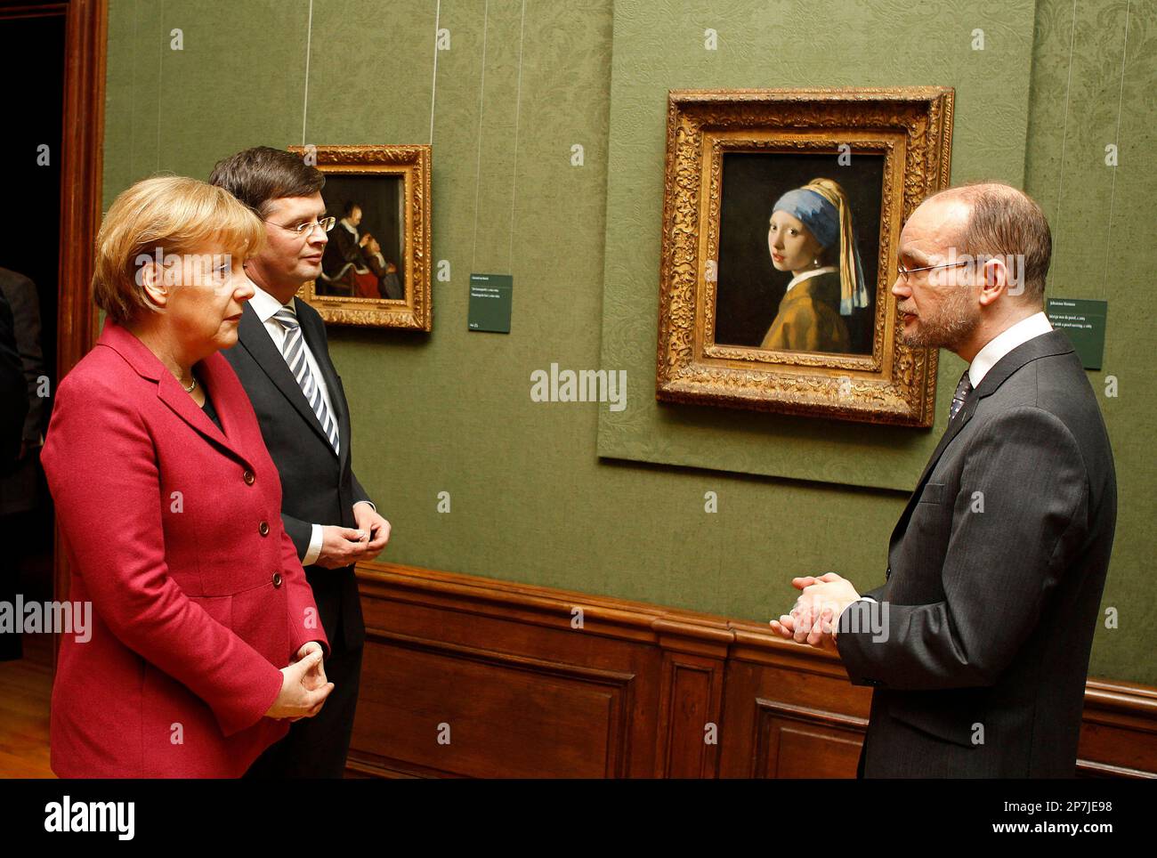 German Chancellor Angela Merkel, left, and Dutch Prime Minister Jan ...