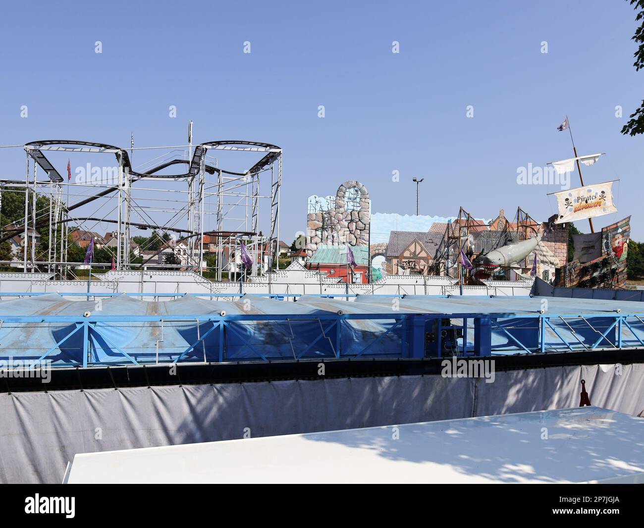 colorful booths and fun rides at a fairground Stock Photo - Alamy
