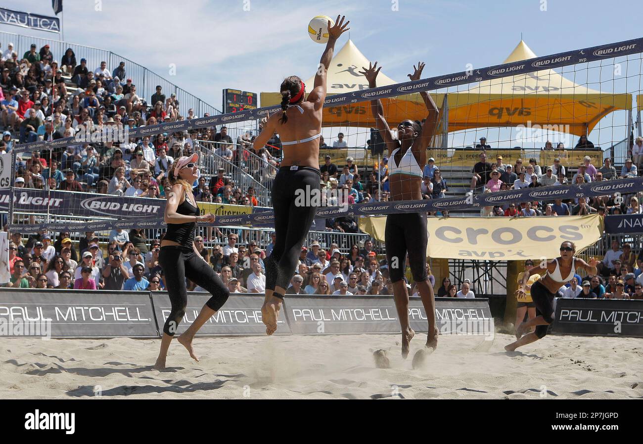 Misty May-Treanor hits a shot over the reach of Jenny Johnson-Jordan as ...