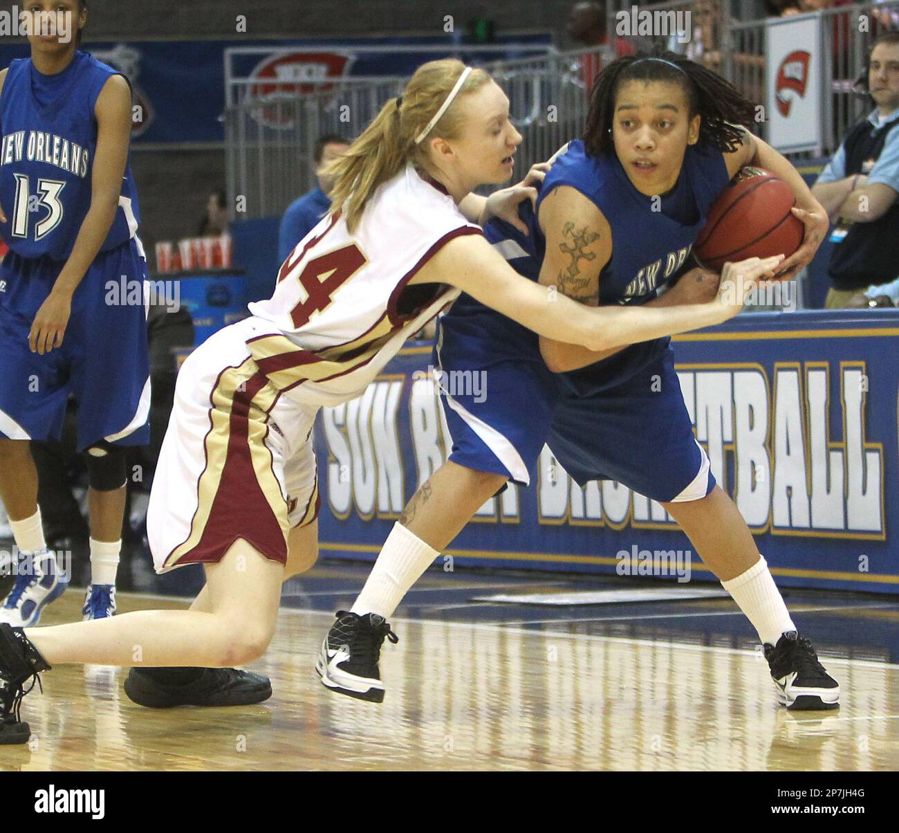 Denver's Sarah Feeney, left, guards New Orleans' Brittany Helm on ...