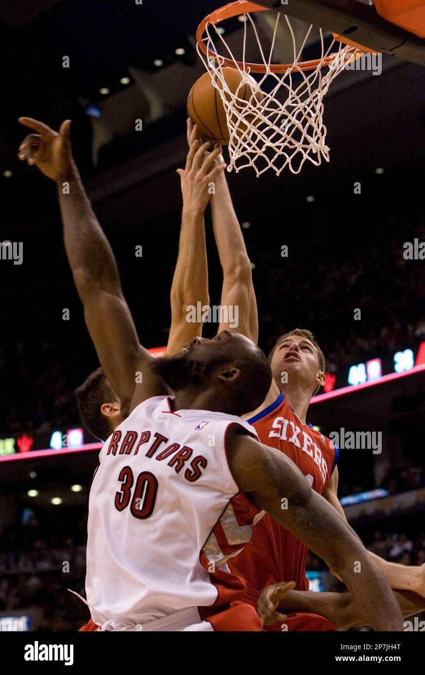 Philadelphia 76ers' Jason Smith, right, jumps for a rebound with ...