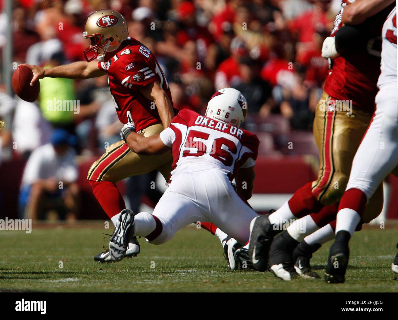 San Francisco 49ers quarterback J.T. O'Sullivan (14) scrambles away ...