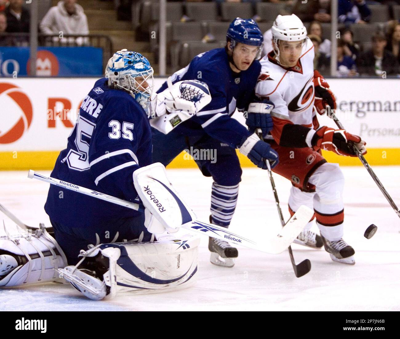 Toronto Maple Leafs goaltender Jean-Sebastien Giguere, left, makes a ...