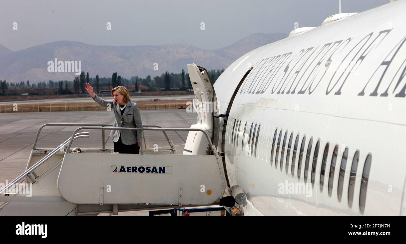 Secretary of State Hillary Rodham Clinton waves as she prepares to ...