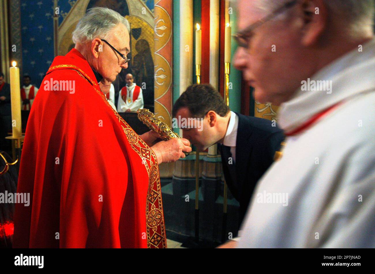 Russian President Dmitry Medvedev, center, kisses a crown of thorns ...