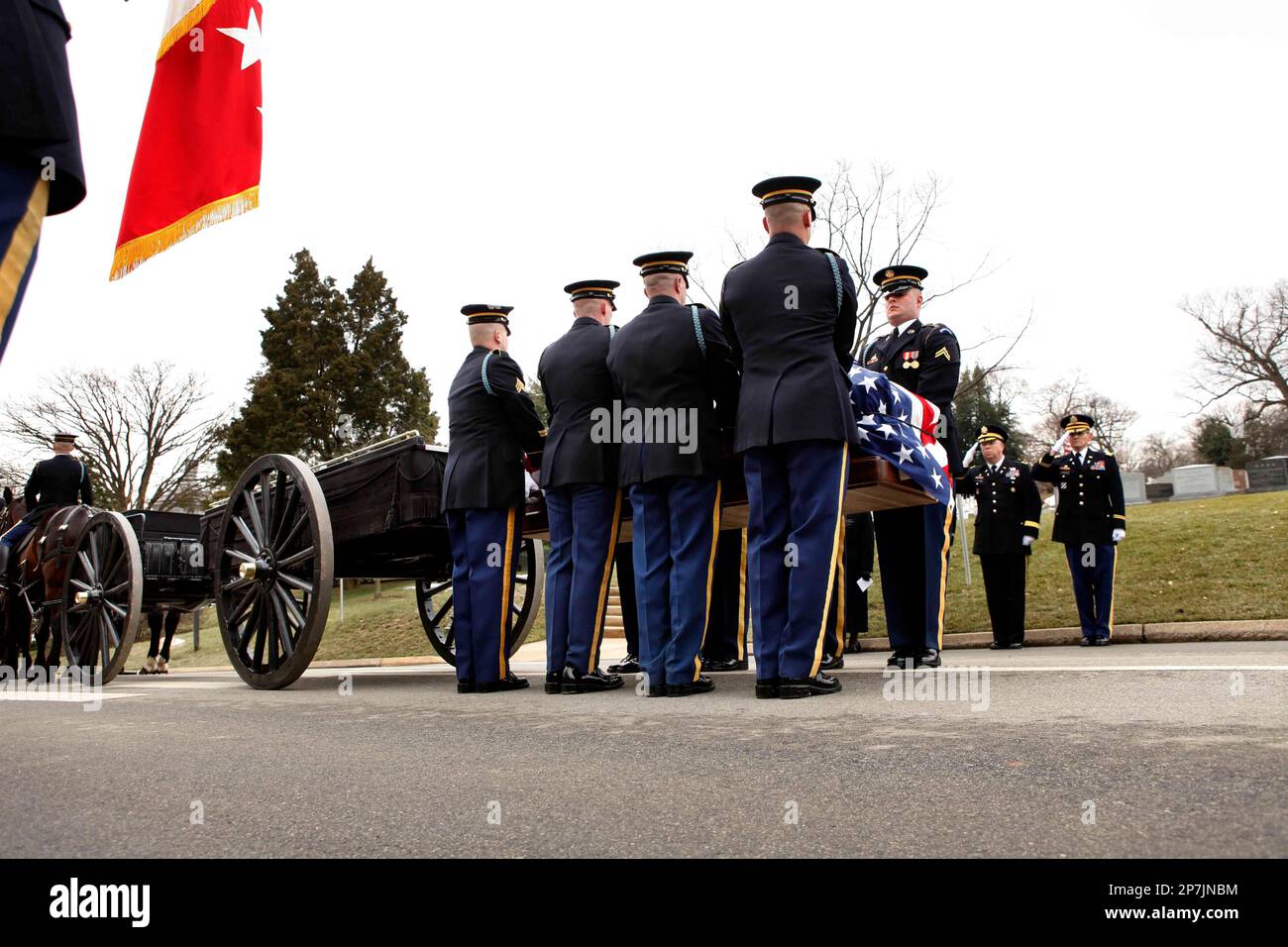 A military honor guard carries the casket of former Secretary of State ...