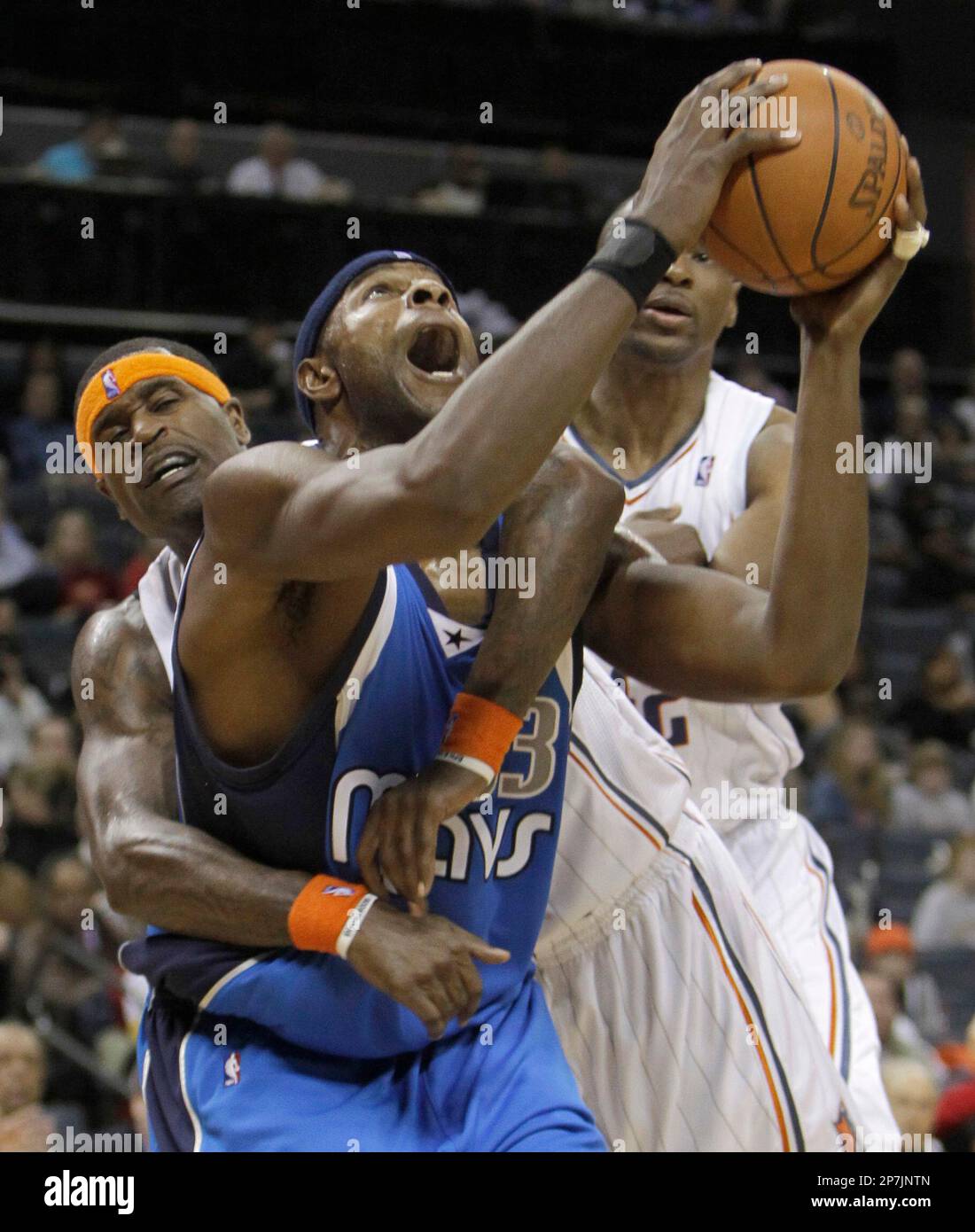 Dallas Mavericks' Brendan Haywood, front, is fouled by Charlotte ...