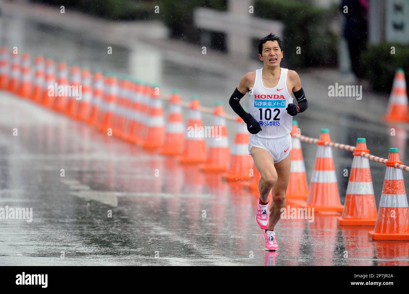 Masakazu Fujiwara of Japan races on his way to win the Tokyo Marathon ...