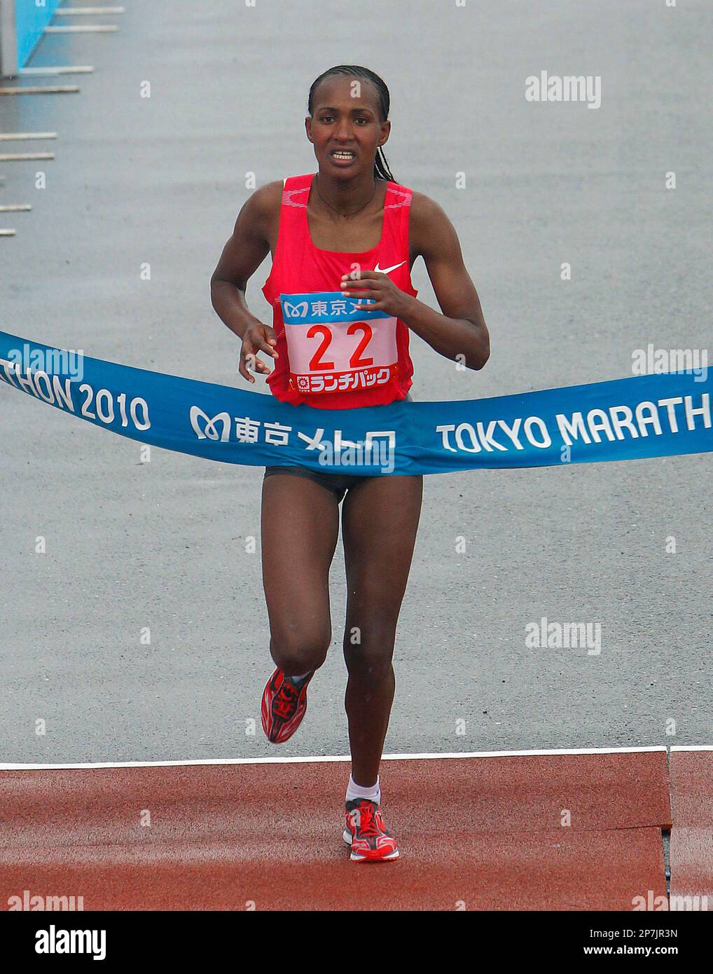 Robe Guta of Ethiopia crosses the finish line at the woman's race of ...