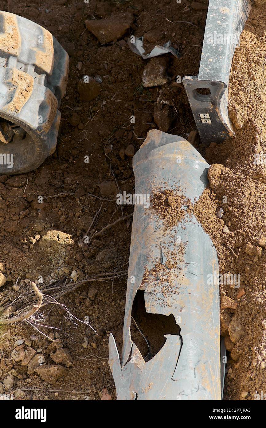 Gray broken plastic pipes for water supply or evacuation. Installation ...