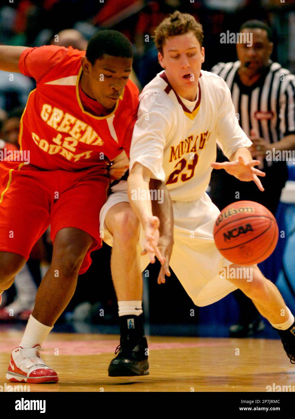 Greene County's Gerald Gaines (12) reaches in for a steal on Madison ...