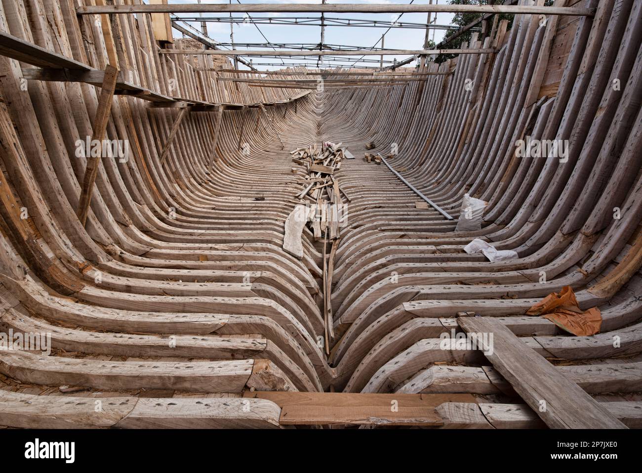 Interior of a giant traditional dhow in the shipbuilding factory of Sur ...