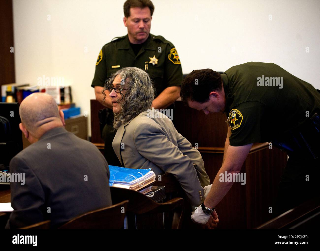 Handcuffs are removed from serial murder suspect Rodney Alcala before ...