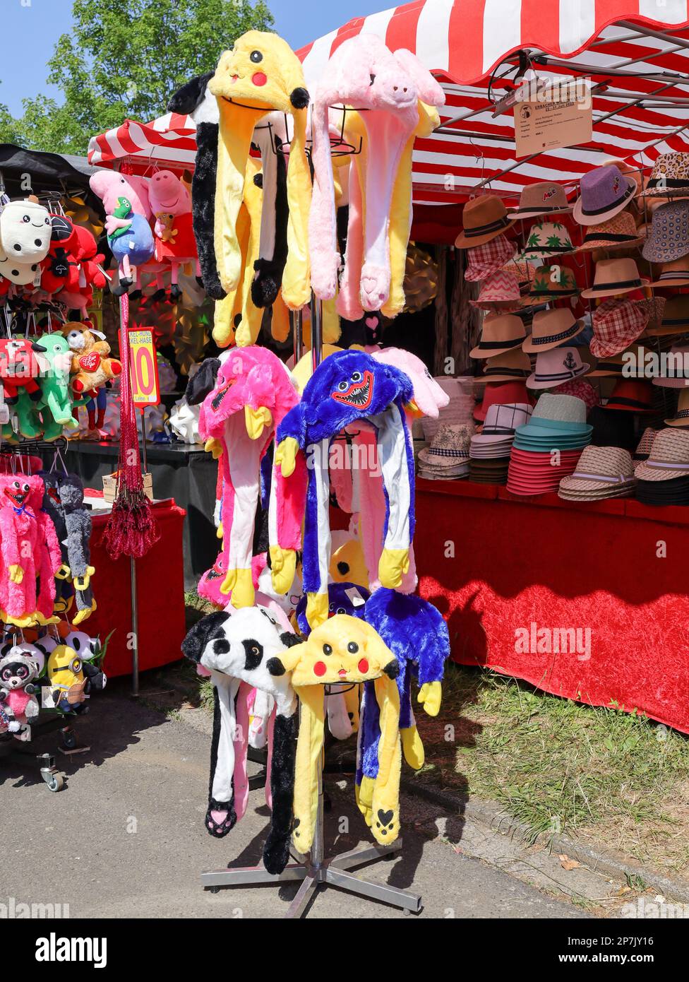 colorful booths and fun rides at a fairground Stock Photo - Alamy