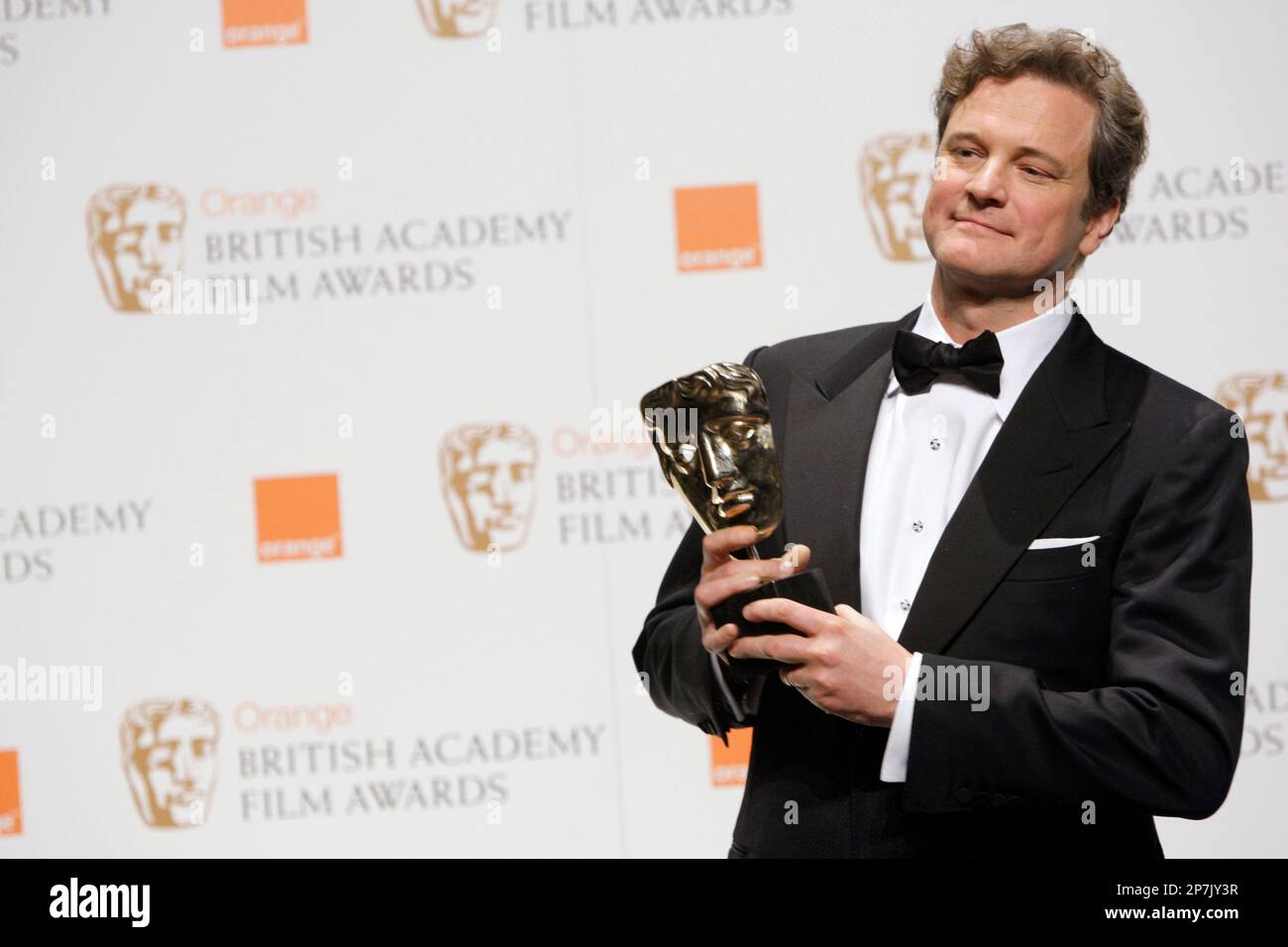 British actor Colin Firth poses with his award after winning Best Actor ...